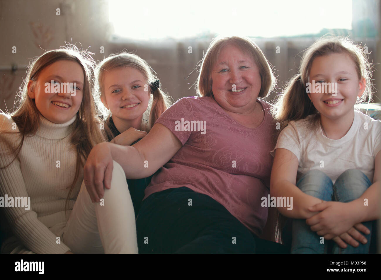 Family portrait of grandmother and three granddaughters Stock Photo - Alamy