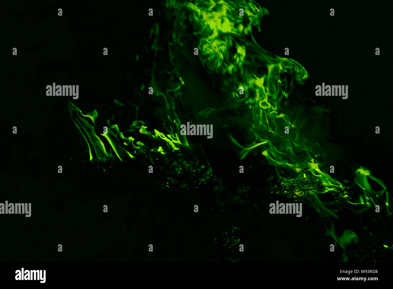 Green flame. Fire. Burning of rice straw at night Stock Photo - Alamy