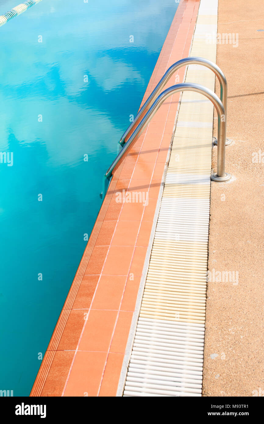 The steel ladder of swimming pool in Day Stock Photo - Alamy