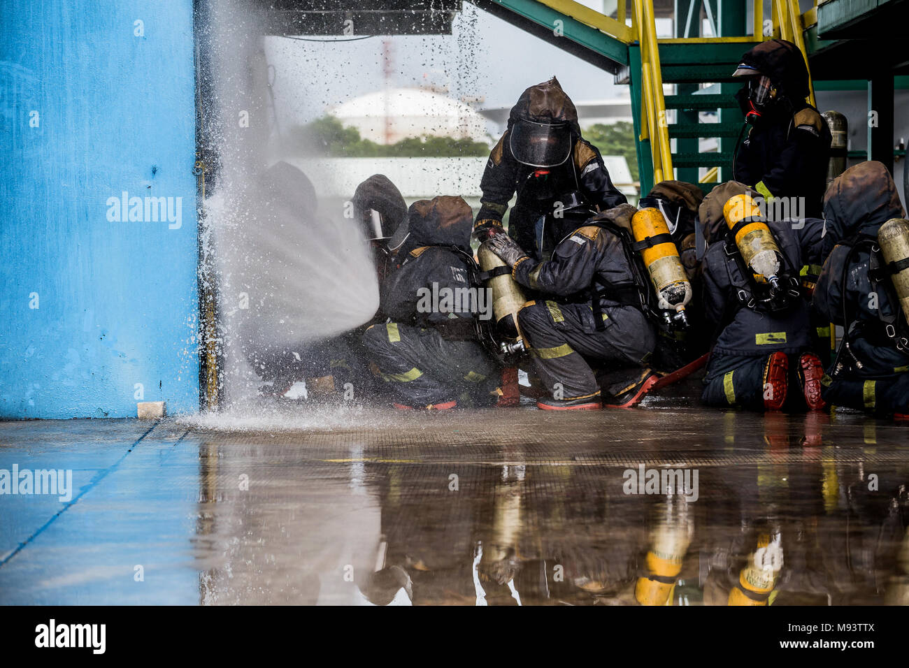 Firemen using hose hi-res stock photography and images - Alamy