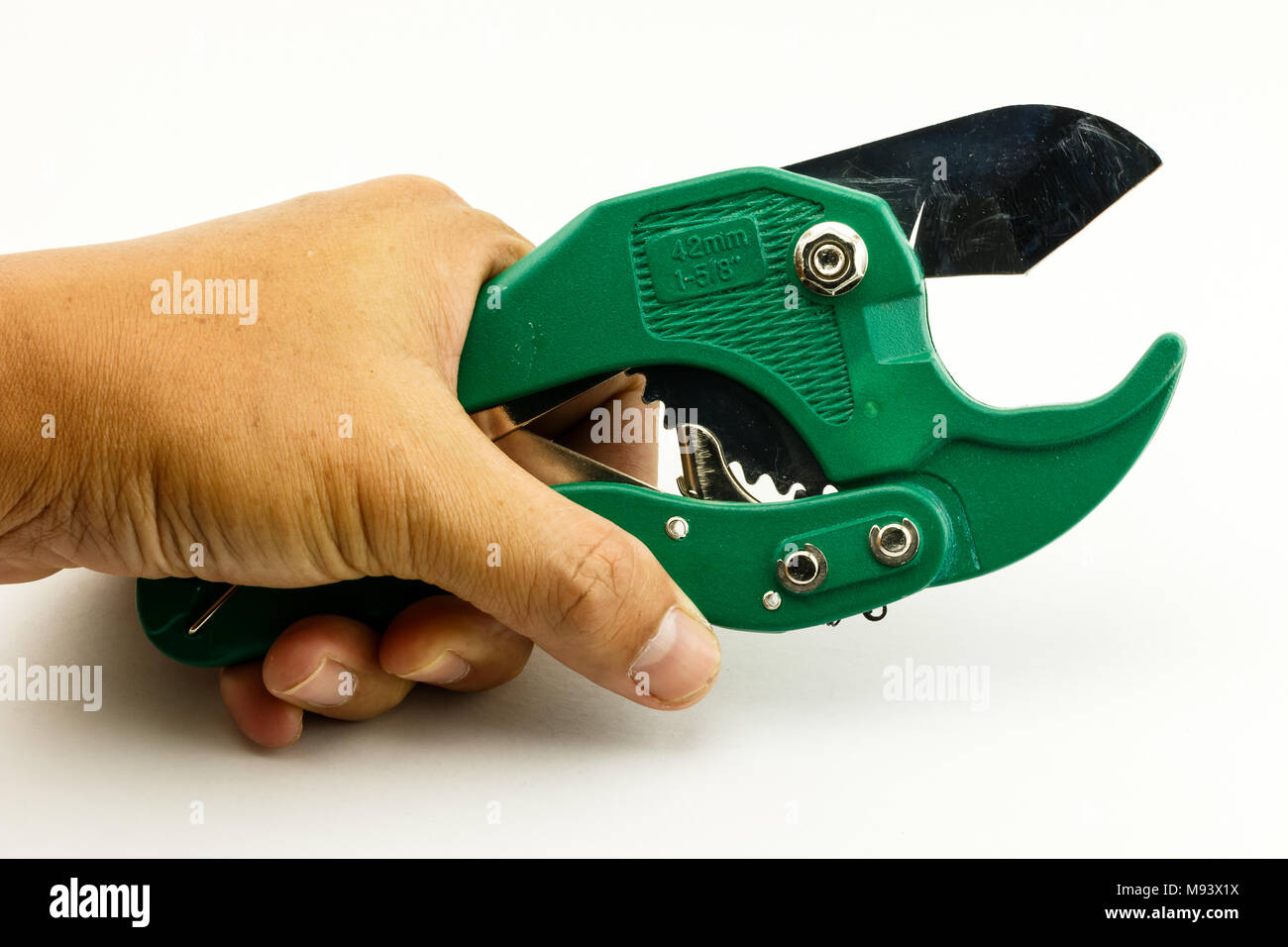 PVC pipe cutter on technician Hand Stock Photo - Alamy