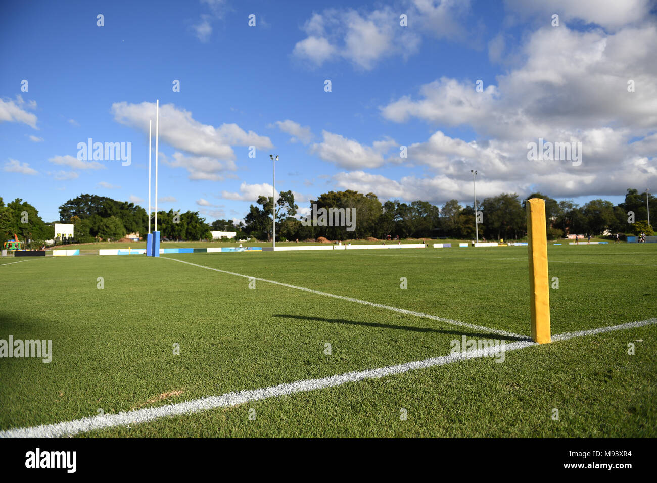 Rugby Goal Posts and corner post on a green field Stock Photo - Alamy