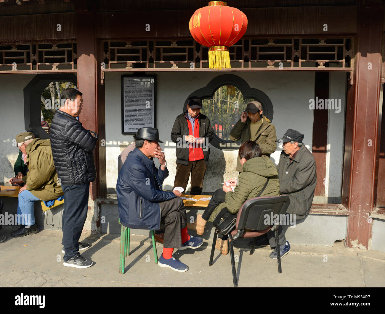 Local residents play card games in Tuanjiehu park, Beijing, China Stock ...