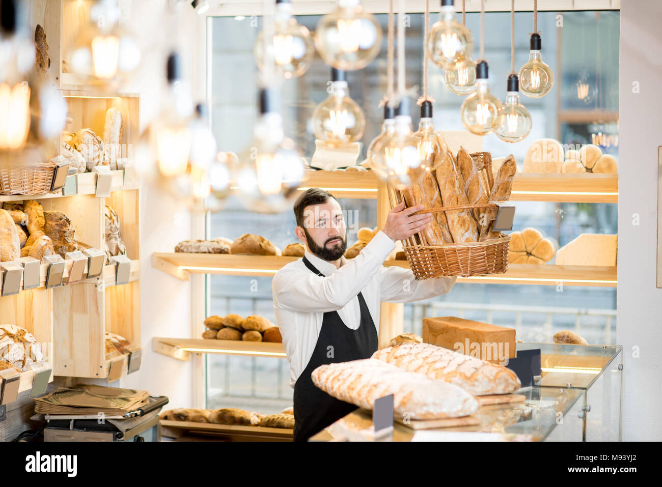 Seller in the bread store Stock Photo - Alamy
