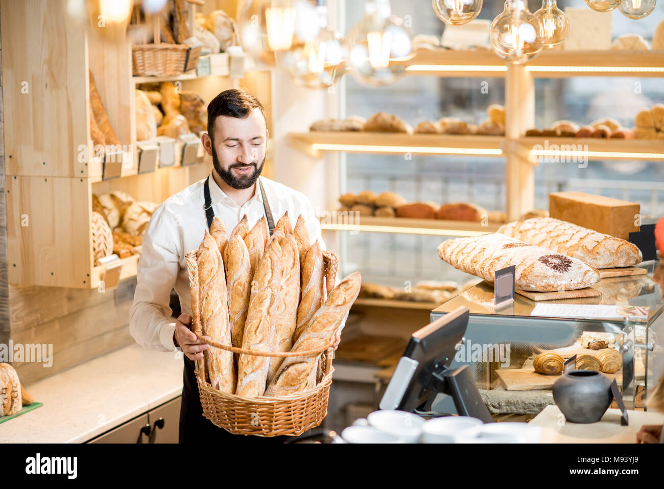 Seller in the bread store Stock Photo - Alamy