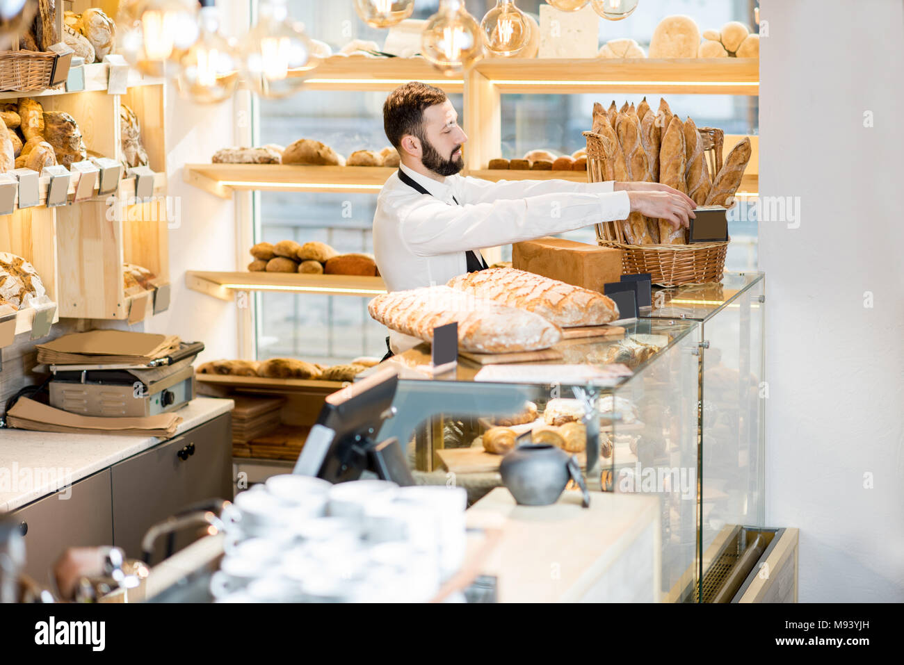 Seller in the bread store Stock Photo - Alamy