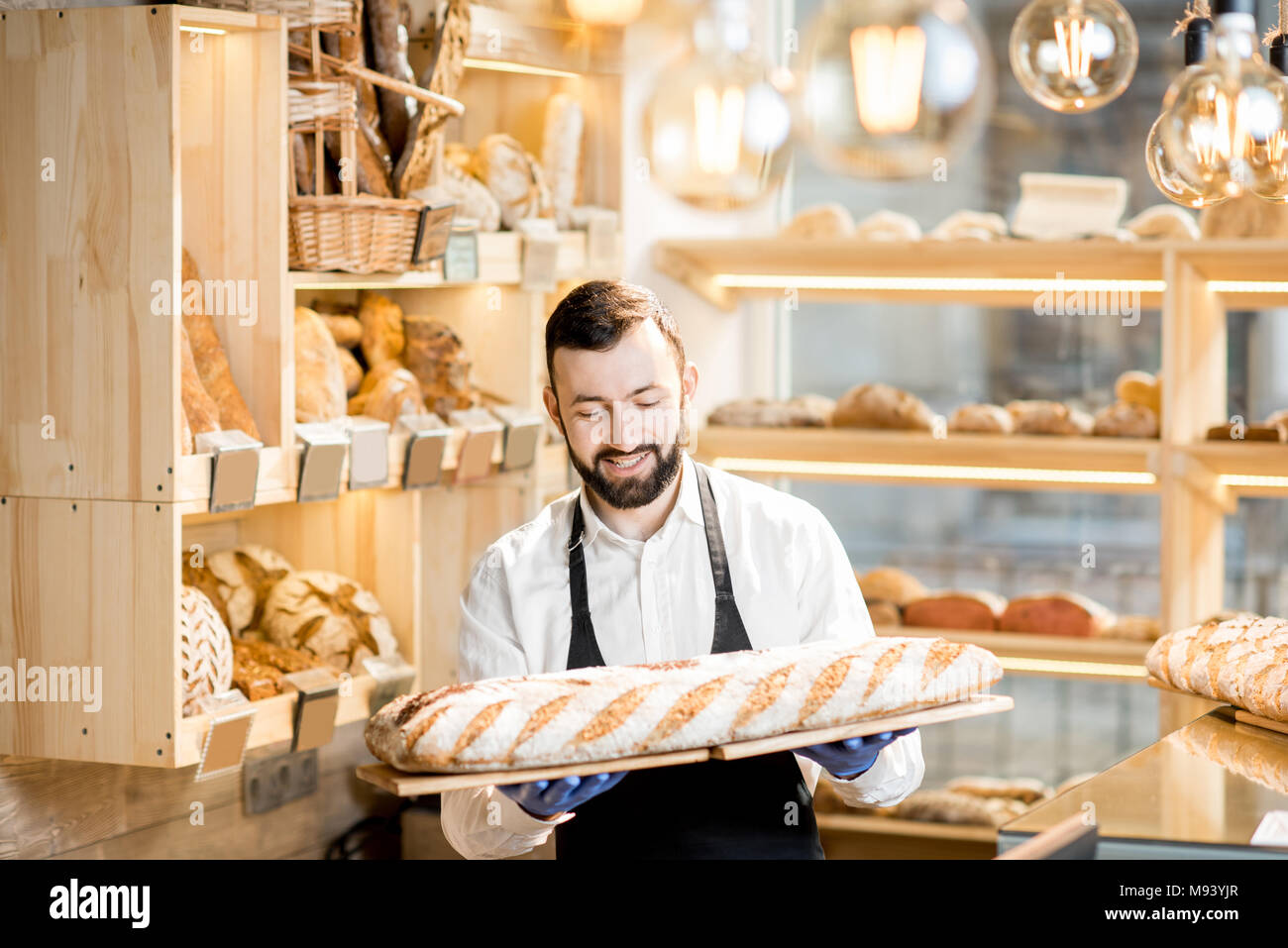 Seller in the bread store Stock Photo - Alamy