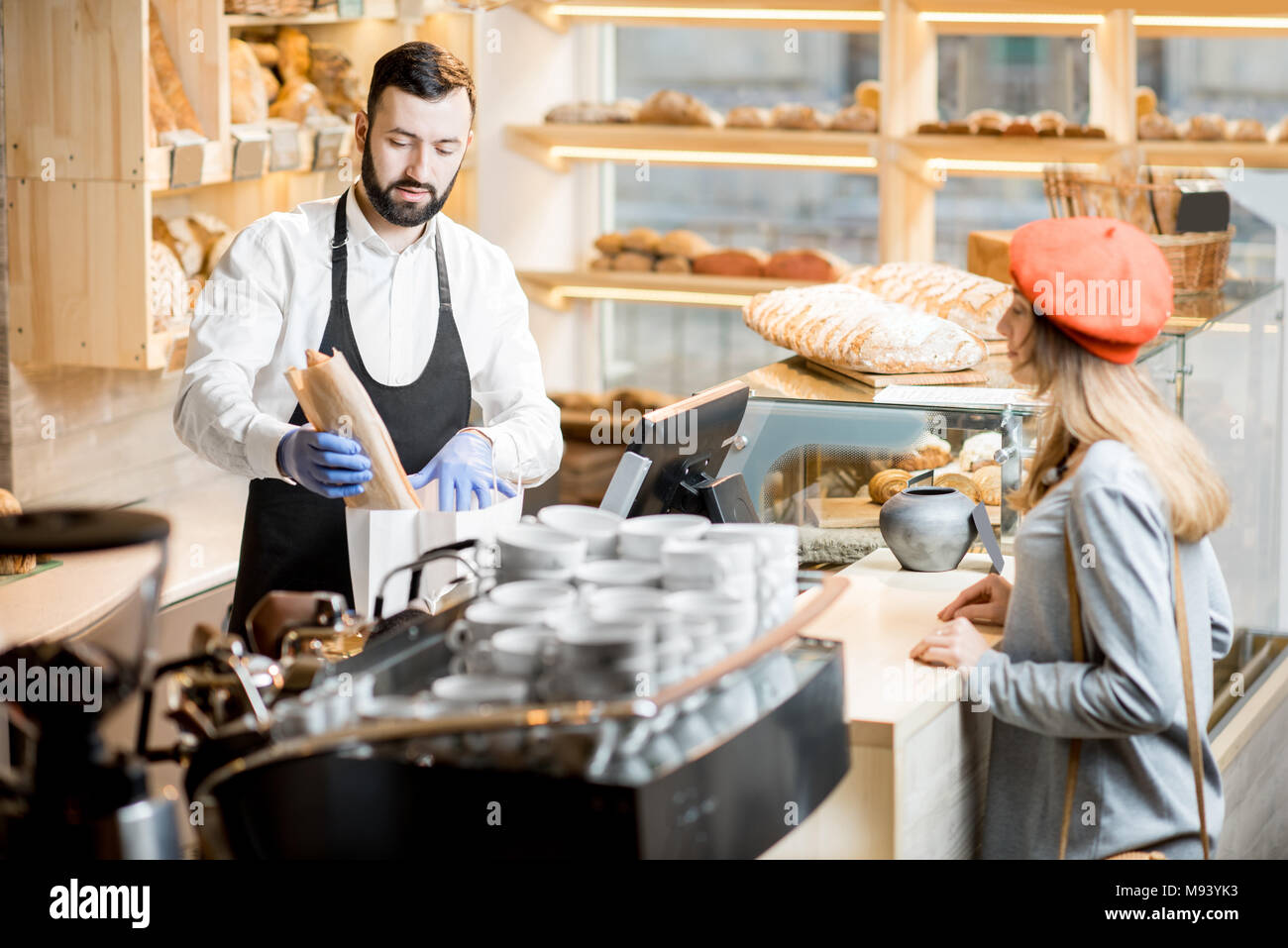 Woman man buying bread hi-res stock photography and images - Alamy