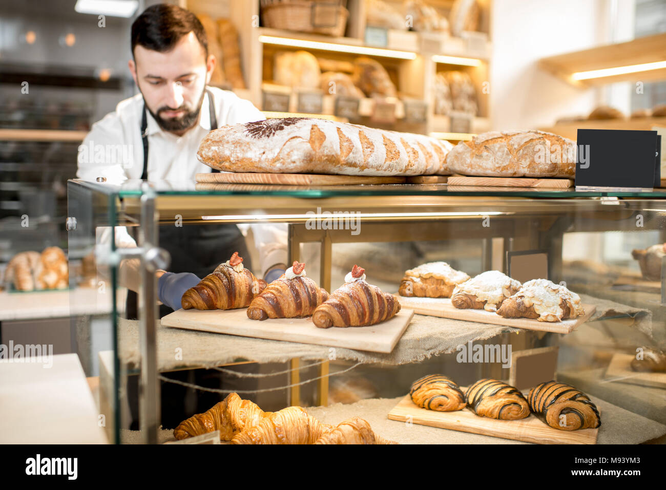 Croissant on the store showcase Stock Photo - Alamy