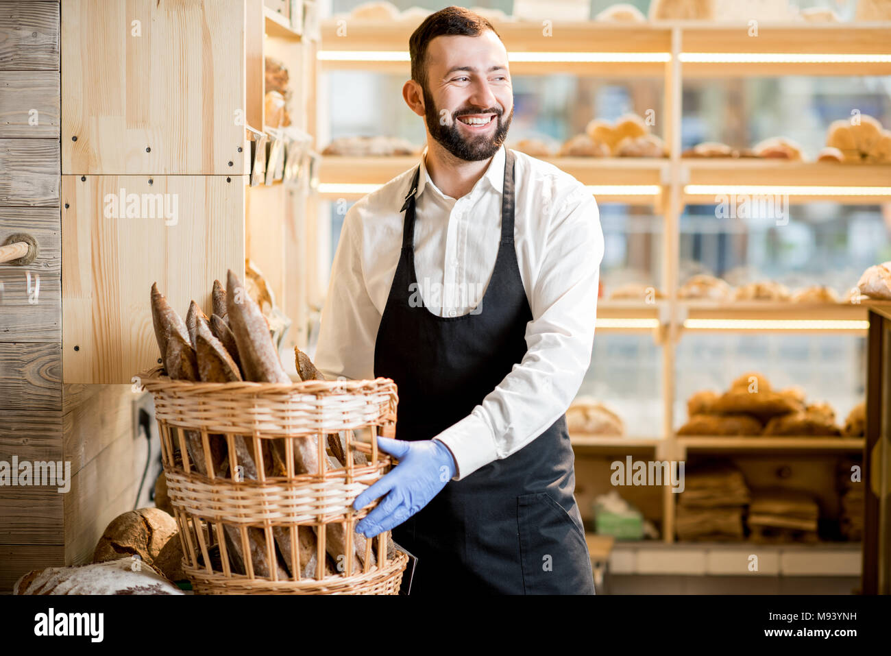 Seller in the bread store Stock Photo - Alamy