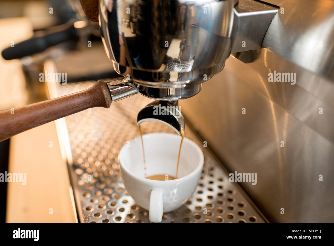 Making espresso with professional coffee machine Stock Photo - Alamy