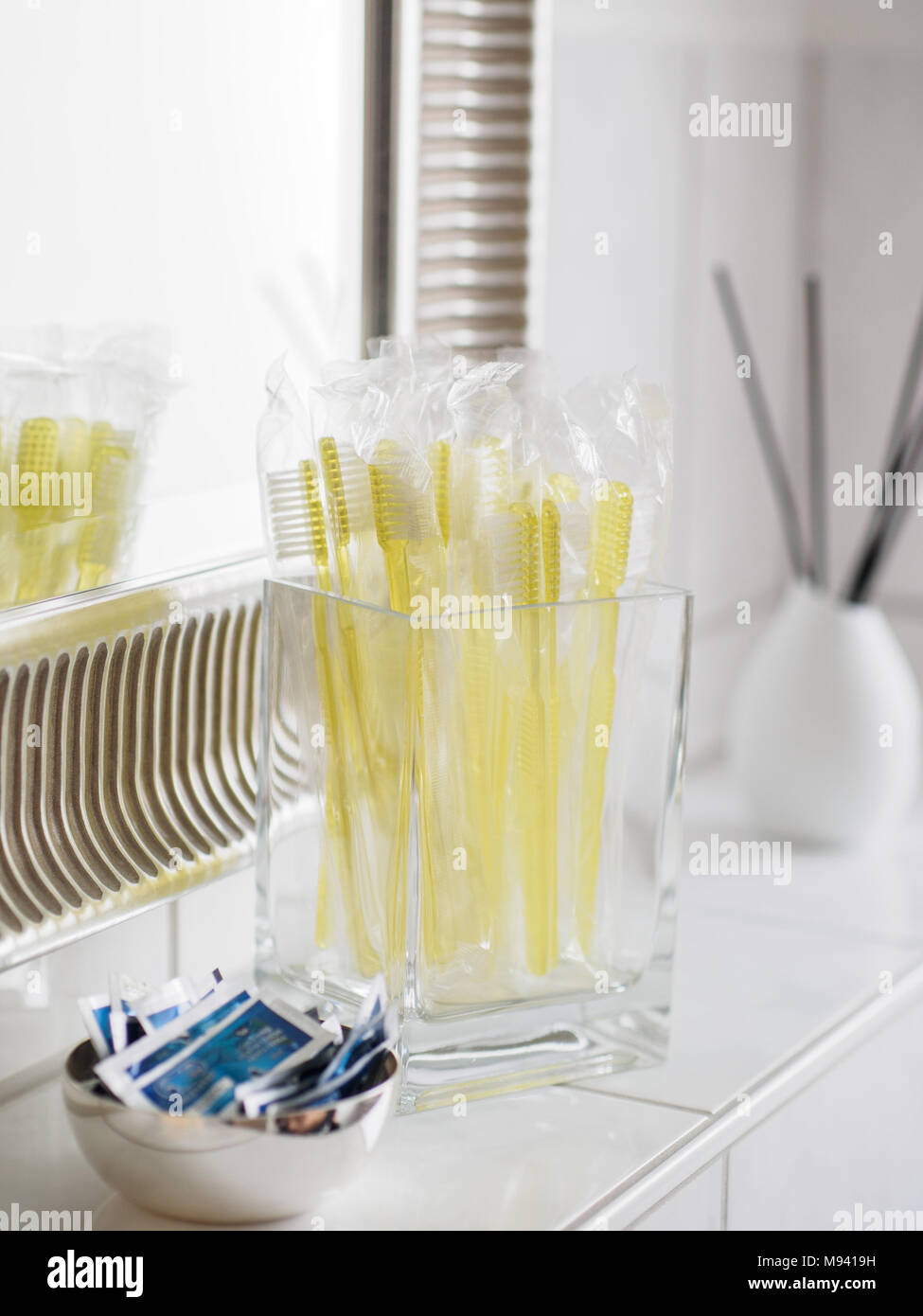the one-toothbrushes in the glass Stock Photo - Alamy