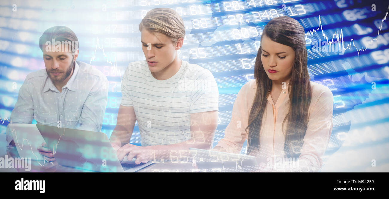 Composite image of focused business people using technology against ...