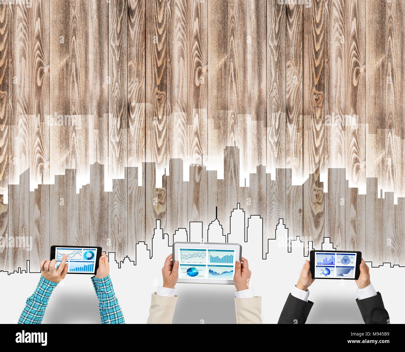 Group of three people with devices in hands working together as symbol ...