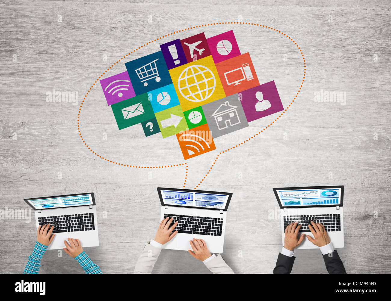 Group of three people with devices in hands working together as symbol ...