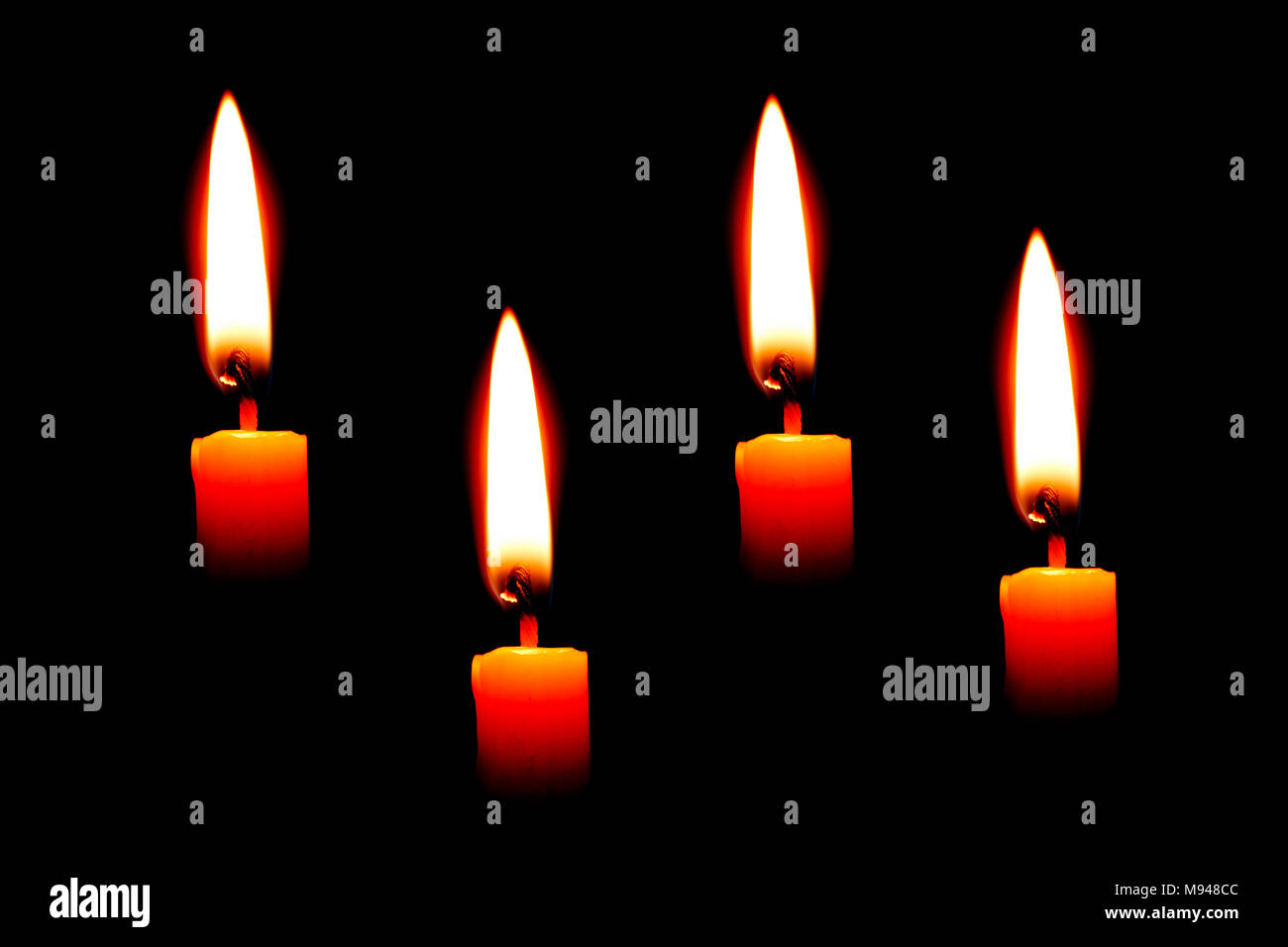 Four Candle on black background Stock Photo - Alamy