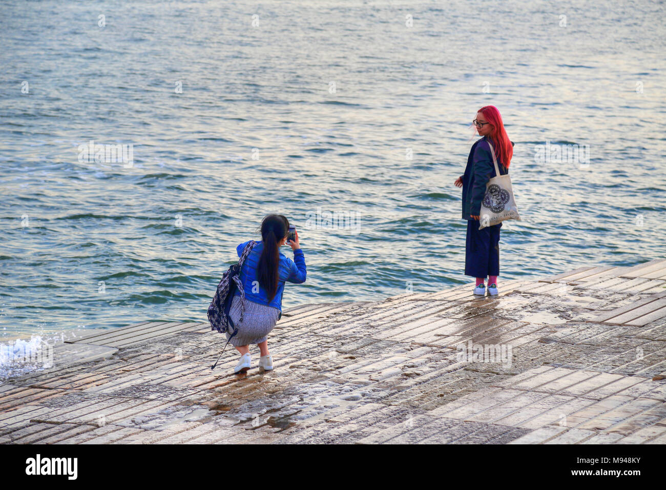 Tourists snapping pictures near Lisbon landmarks Stock Photo - Alamy