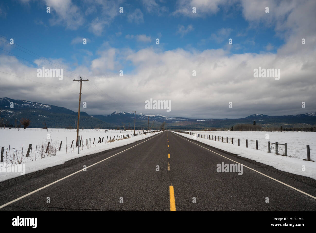 Snow has been cleared from the road on this winter route in the United ...