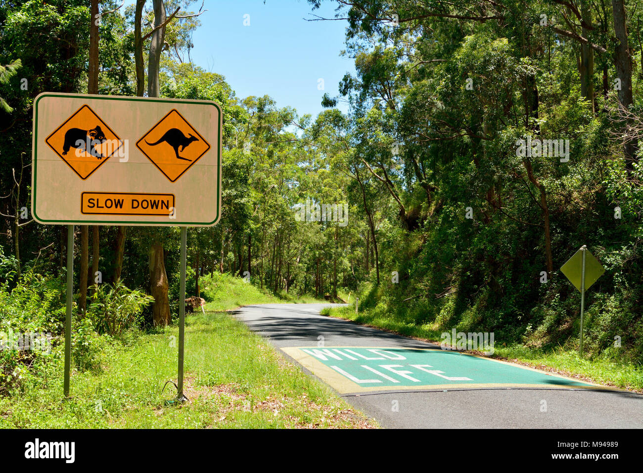Drive Slowly traffic sign along the road in Australia, with images of ...