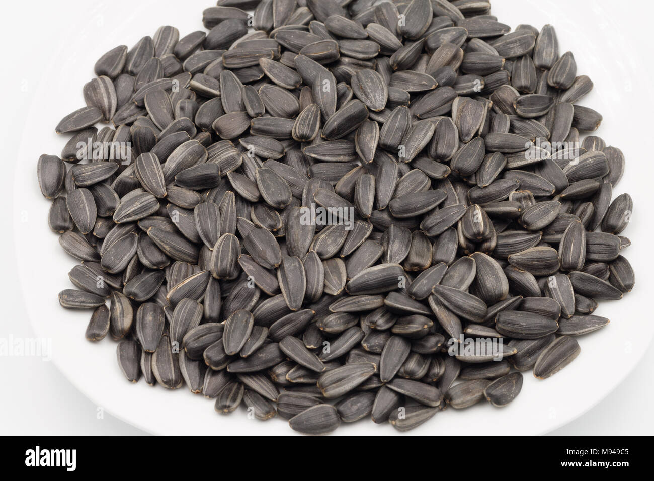 Sunflower black seeds. View from above. Close-up Stock Photo - Alamy