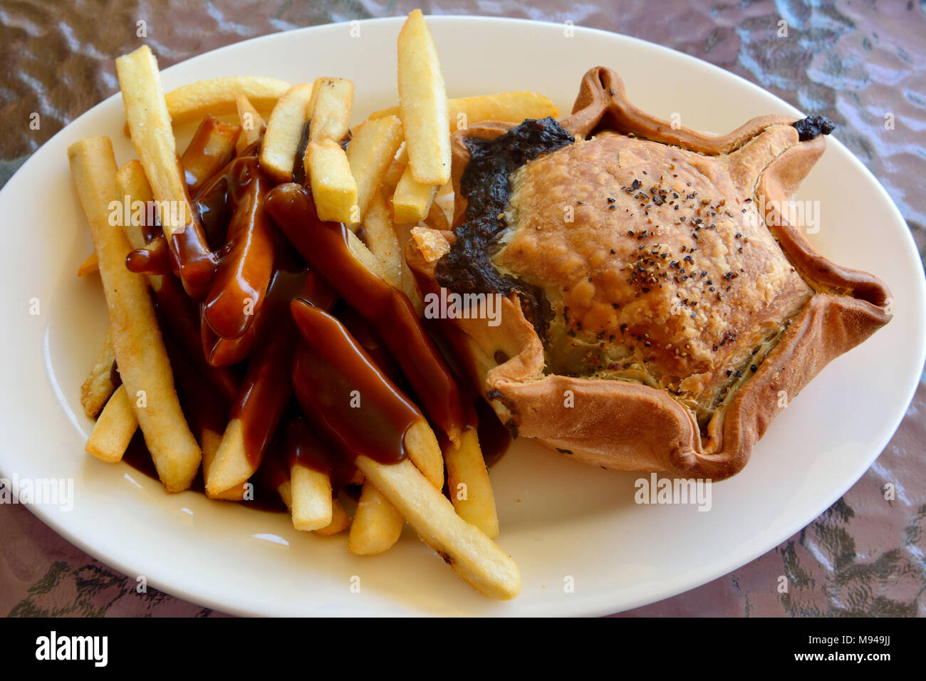 Plate with traditional beef pie and chips Stock Photo - Alamy