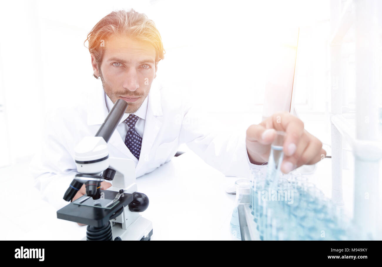 laboratory scientist working in a laboratory with a microscope Stock ...