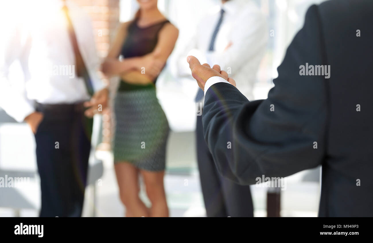rear view.closeup. businessman holding out hand for a handshake Stock ...