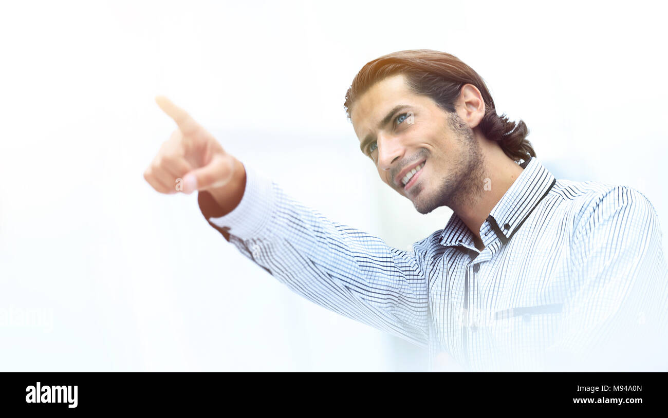 successful young man pointing forward Stock Photo - Alamy
