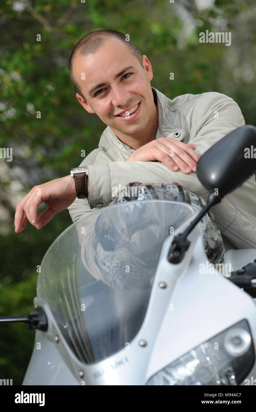 Young man with motorcycle Stock Photo - Alamy