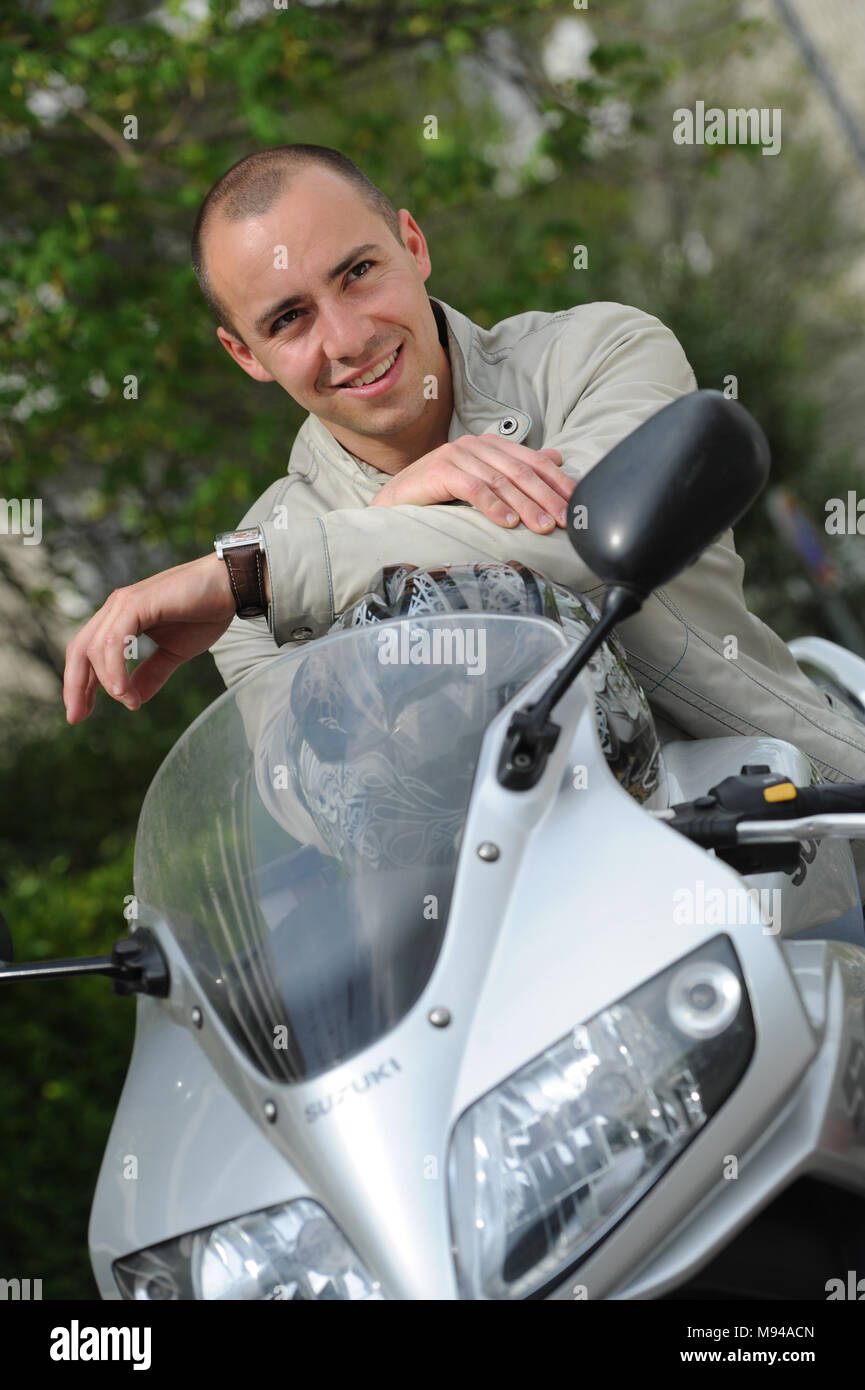 Young man with motorcycle Stock Photo - Alamy