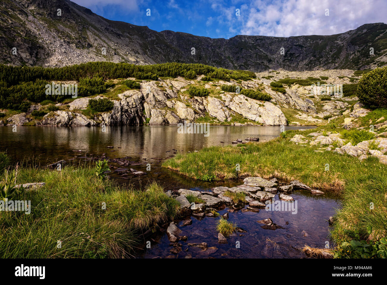 Serene cauldron in the high mountains of central Romania with glacial ...