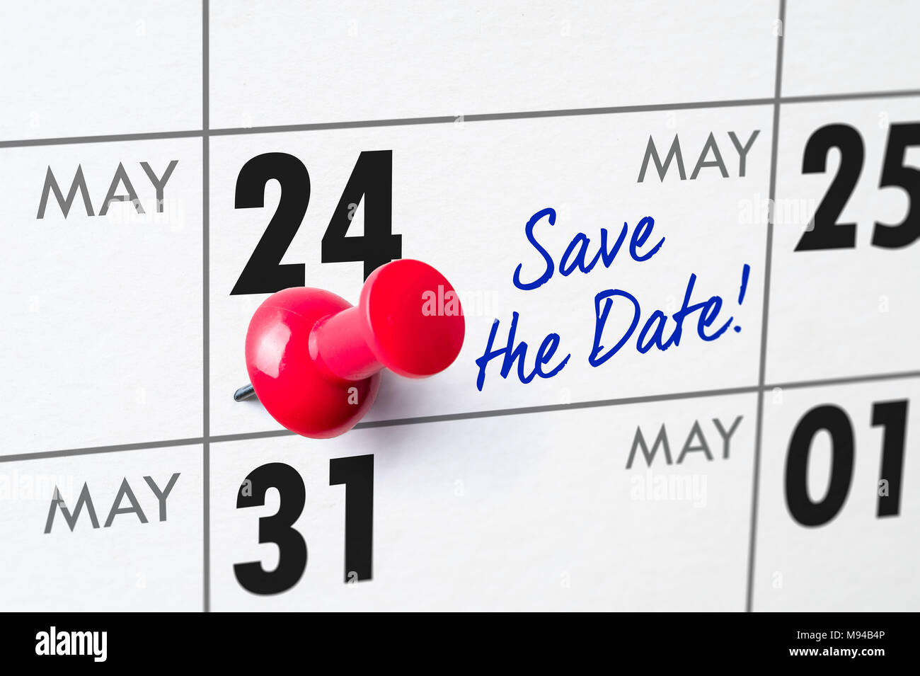 Wall calendar with a red pin - May 24 Stock Photo - Alamy