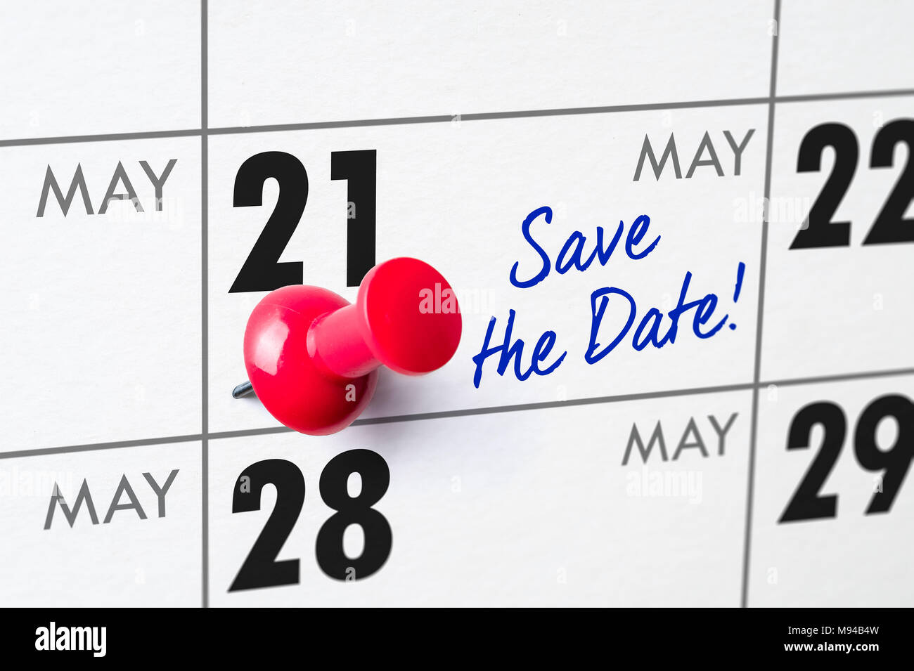 Wall calendar with a red pin - May 21 Stock Photo - Alamy