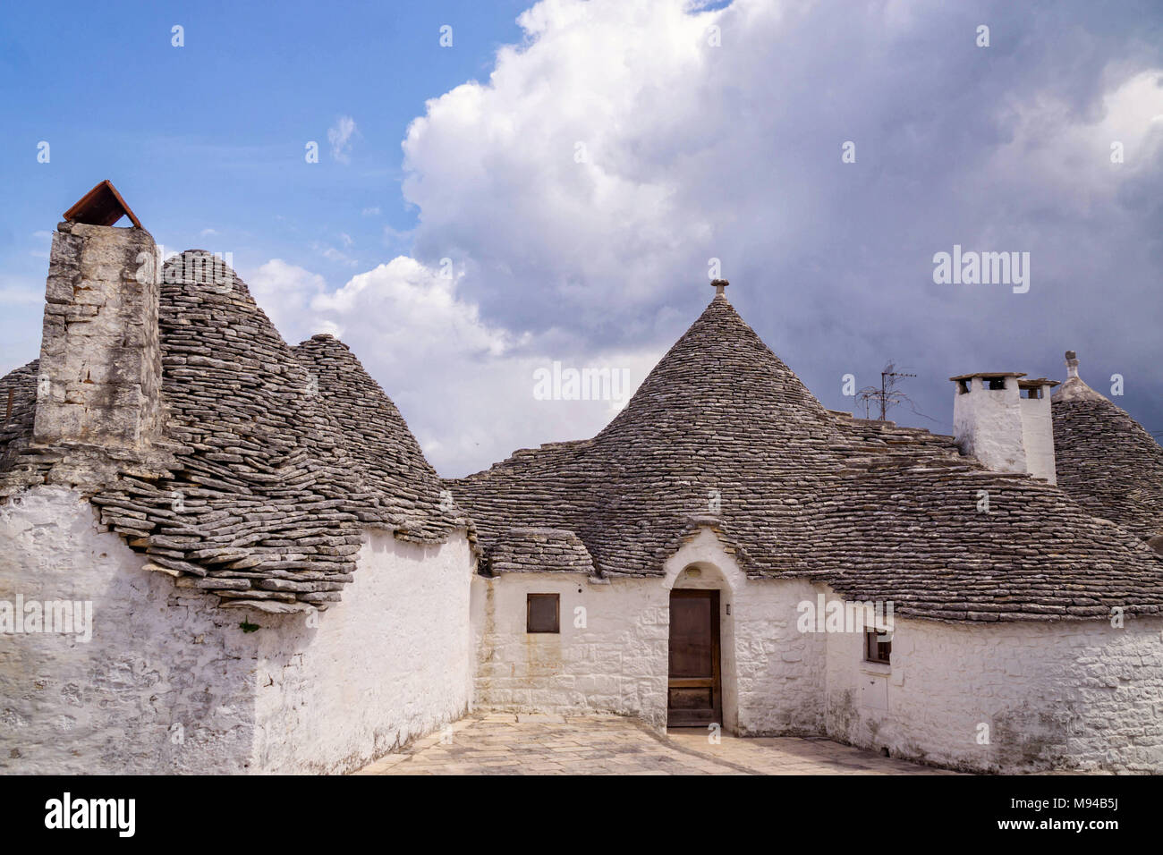 Beautiful white houses of Alberobello town in Italy with their specific ...