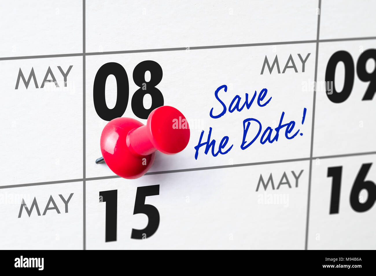 Wall calendar with a red pin - May 08 Stock Photo - Alamy