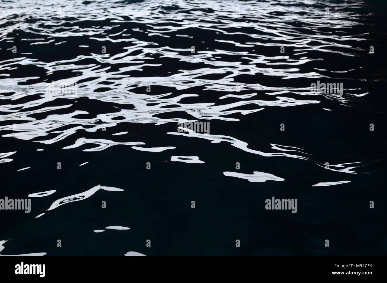 Deep blue water reflects hi-res stock photography and images - Alamy