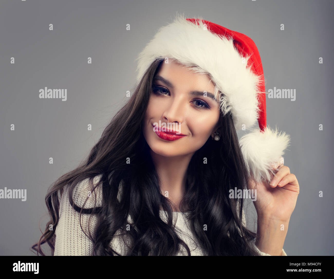 Christmas Model Woman Wearing Santa Hat. Cute Girl Fashion Model with ...