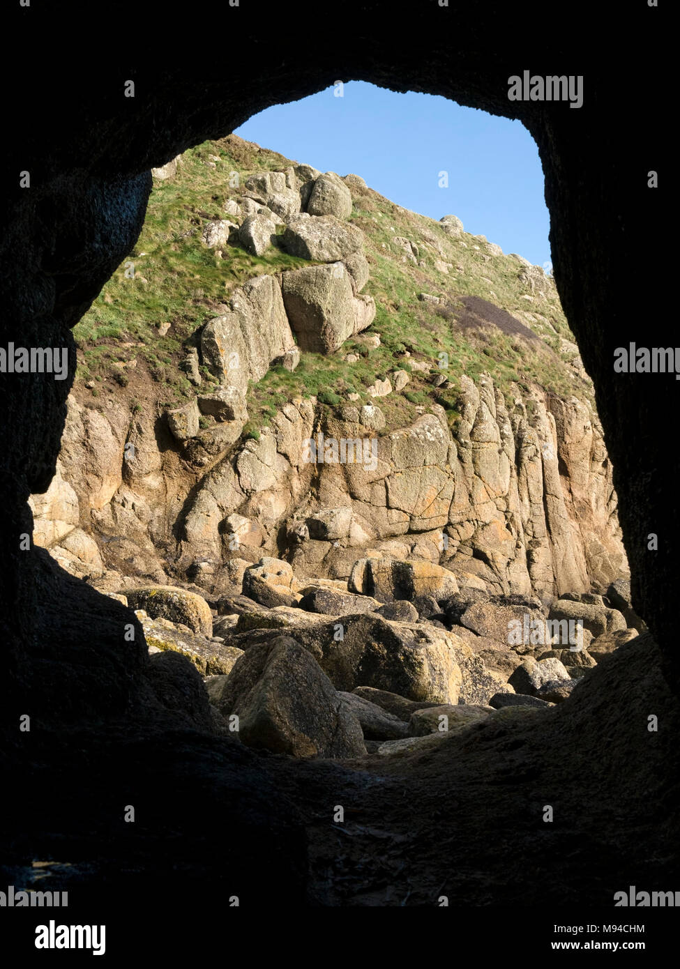 Cave tunnel in cliffs at Porthgwarra Cove used during filming of BBC TV ...