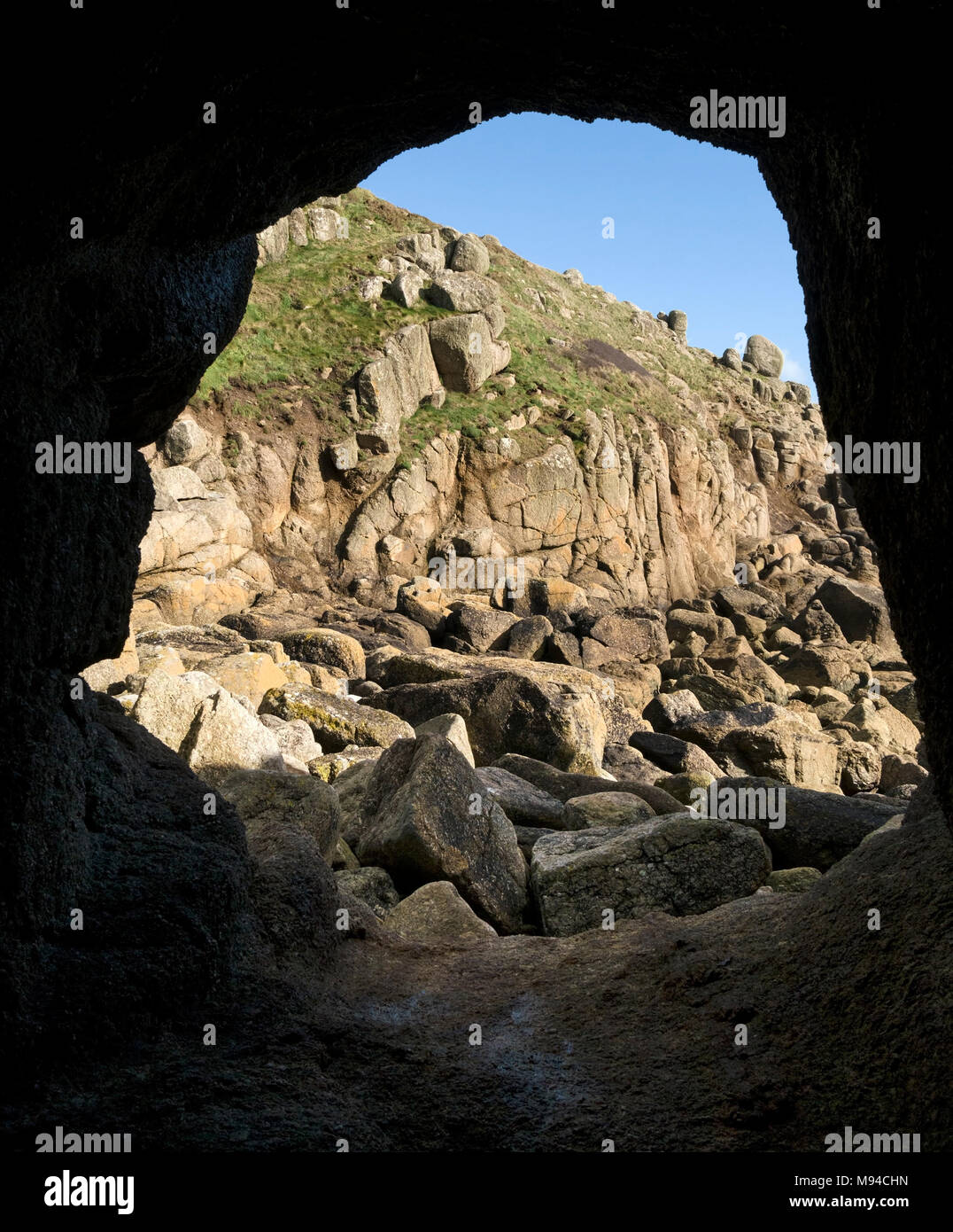 Cave tunnel in cliffs at Porthgwarra Cove used during filming of BBC TV ...