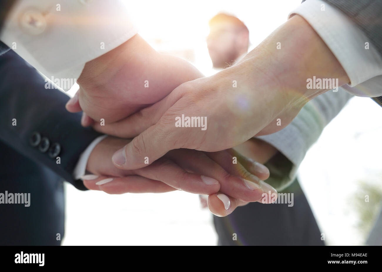 business people folding their hands together Stock Photo - Alamy