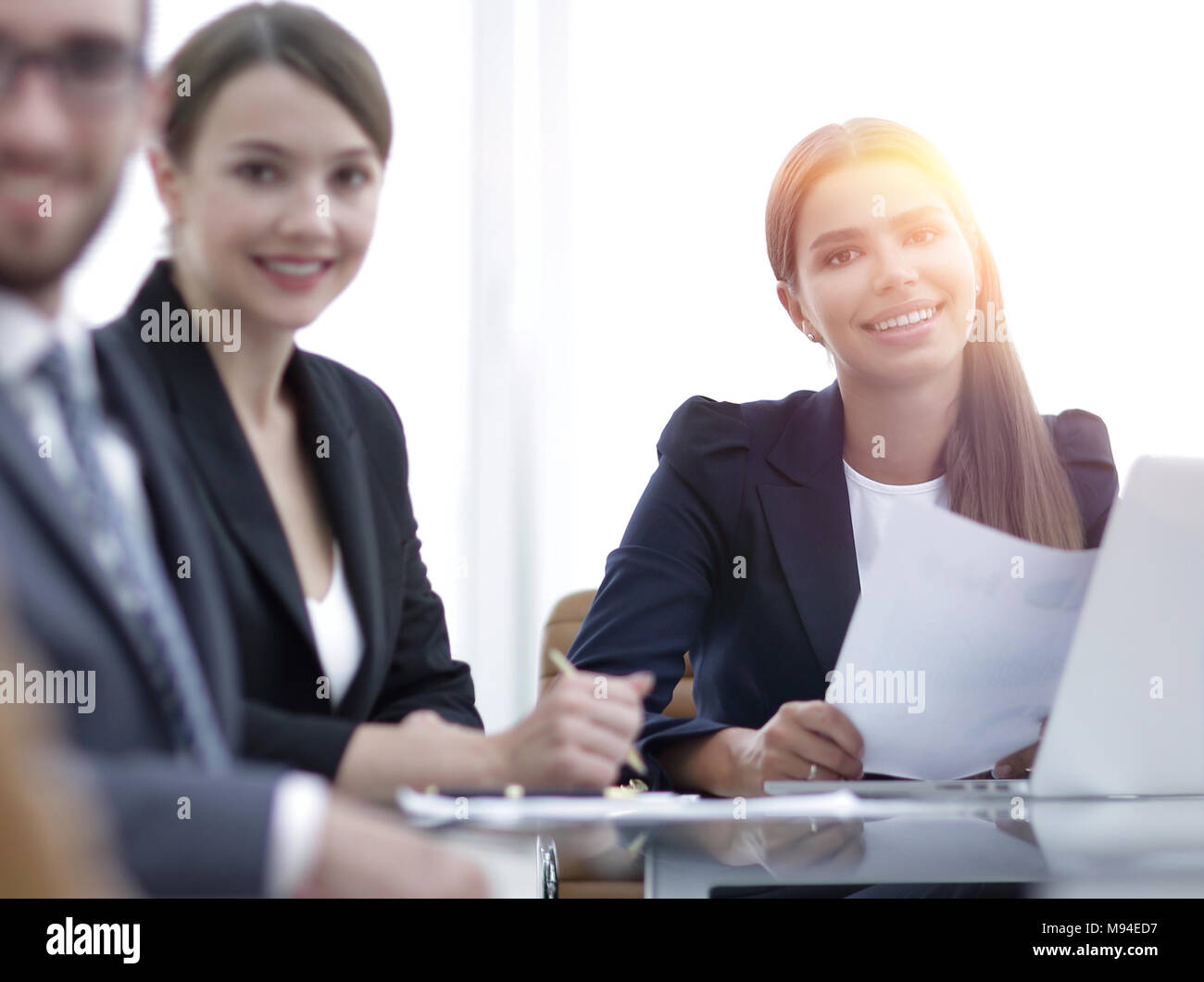 employees sitting behind a Desk Stock Photo - Alamy