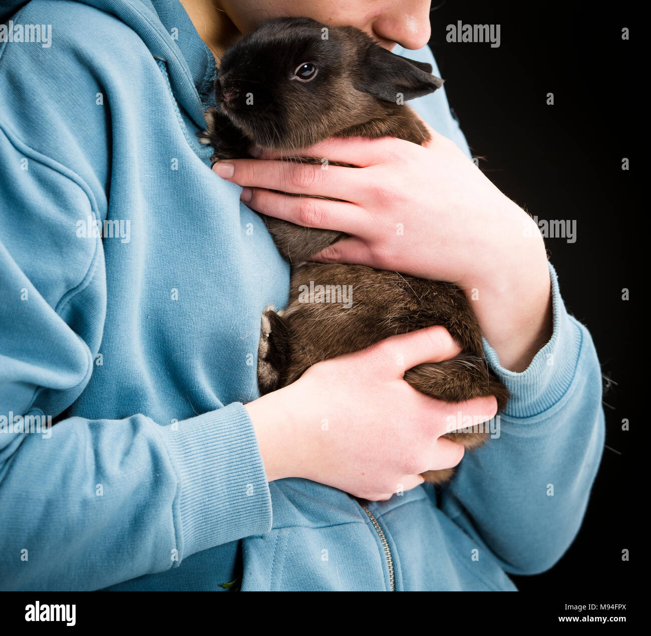 Girl holding a rabbit hi-res stock photography and images - Alamy