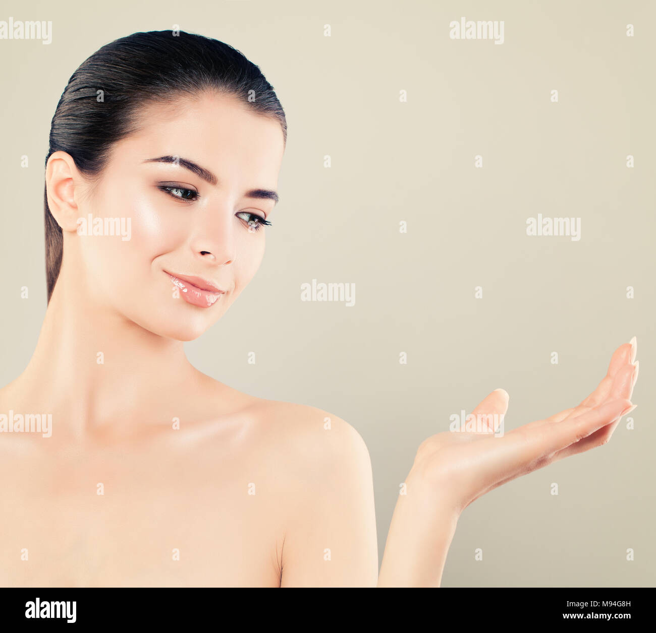 Spa Woman Fashion Model Smiling and Showing Empty Hand Stock Photo - Alamy