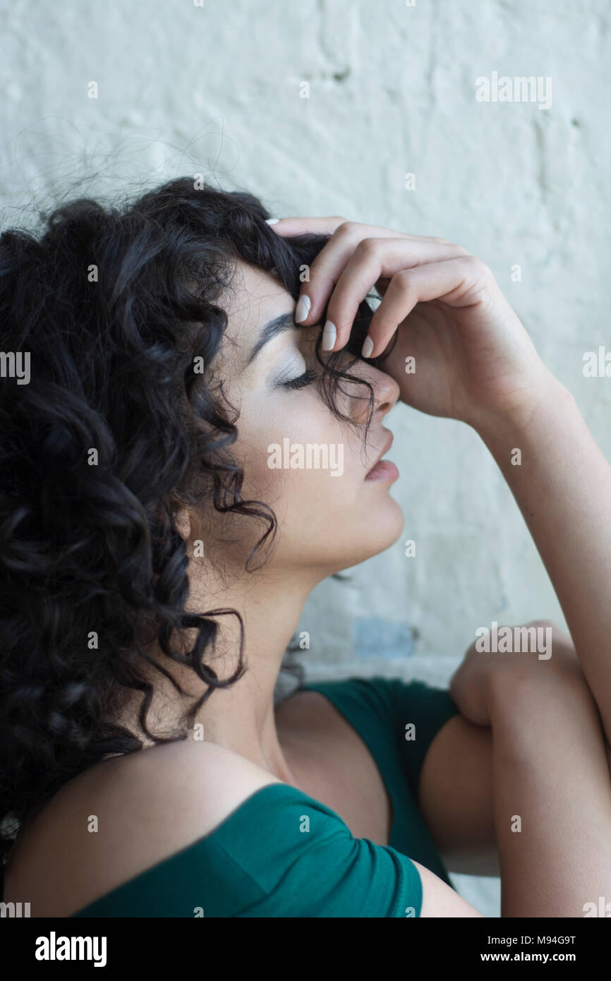 Side view portrait of a stressed young woman hand on forehead Stock ...