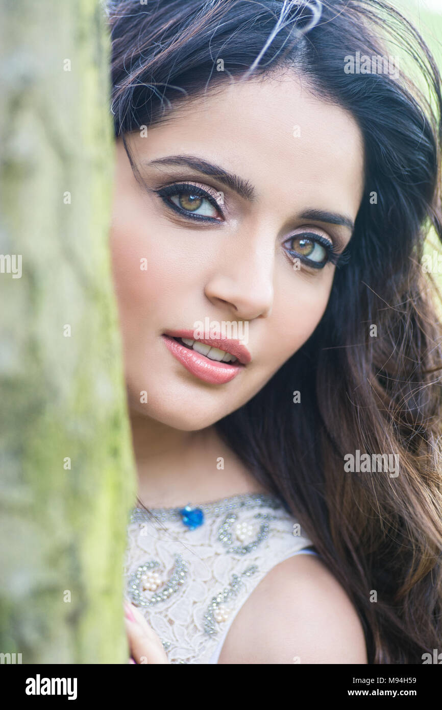 Beautiful young woman hiding behind hi-res stock photography and images ...