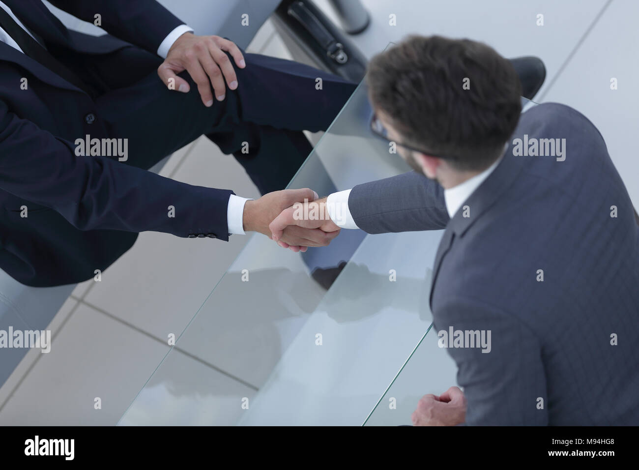 handshake Manager and the client in the office Stock Photo - Alamy
