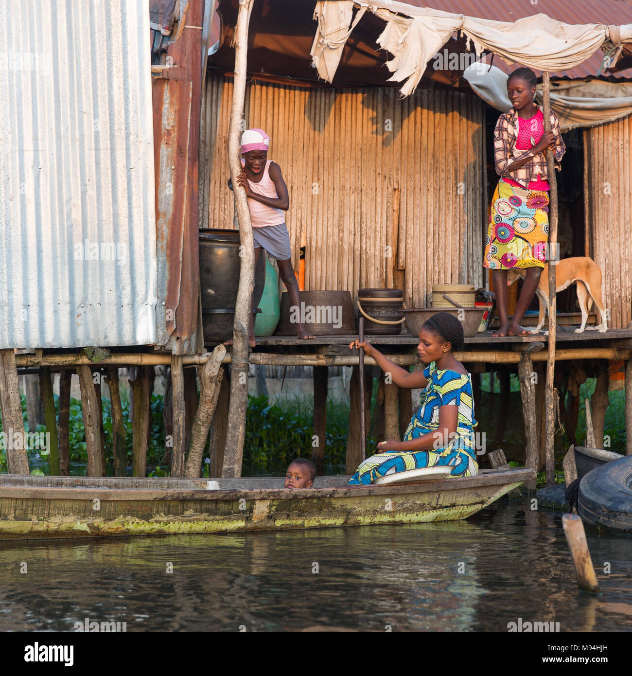 A typical family scene in Ganvie, southern Benin Stock Photo - Alamy