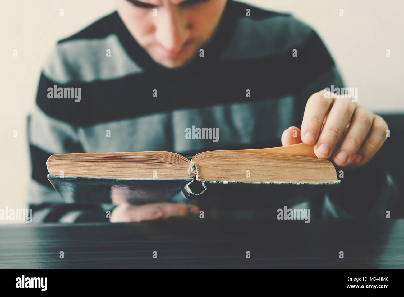 Man sitting at table hi-res stock photography and images - Alamy