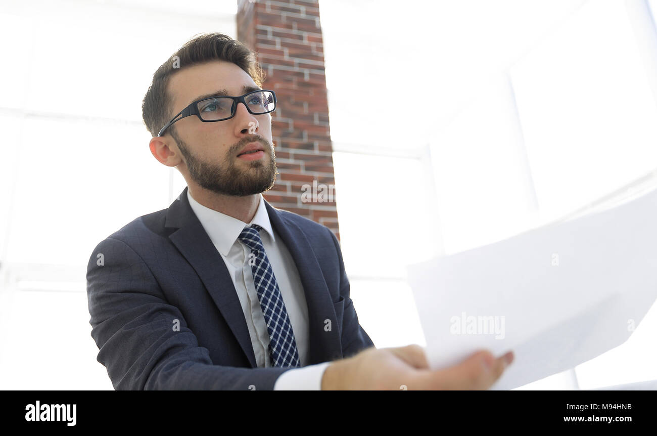 Image of business man holding paper Stock Photo - Alamy