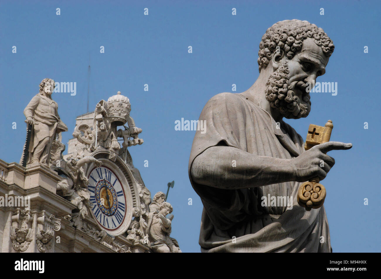 Vatican City. St. Peter's basilica and the statue of St. Peter with the ...